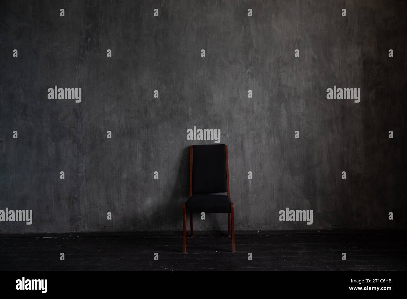 One black vintage chair in the interior of an empty dark room Stock ...