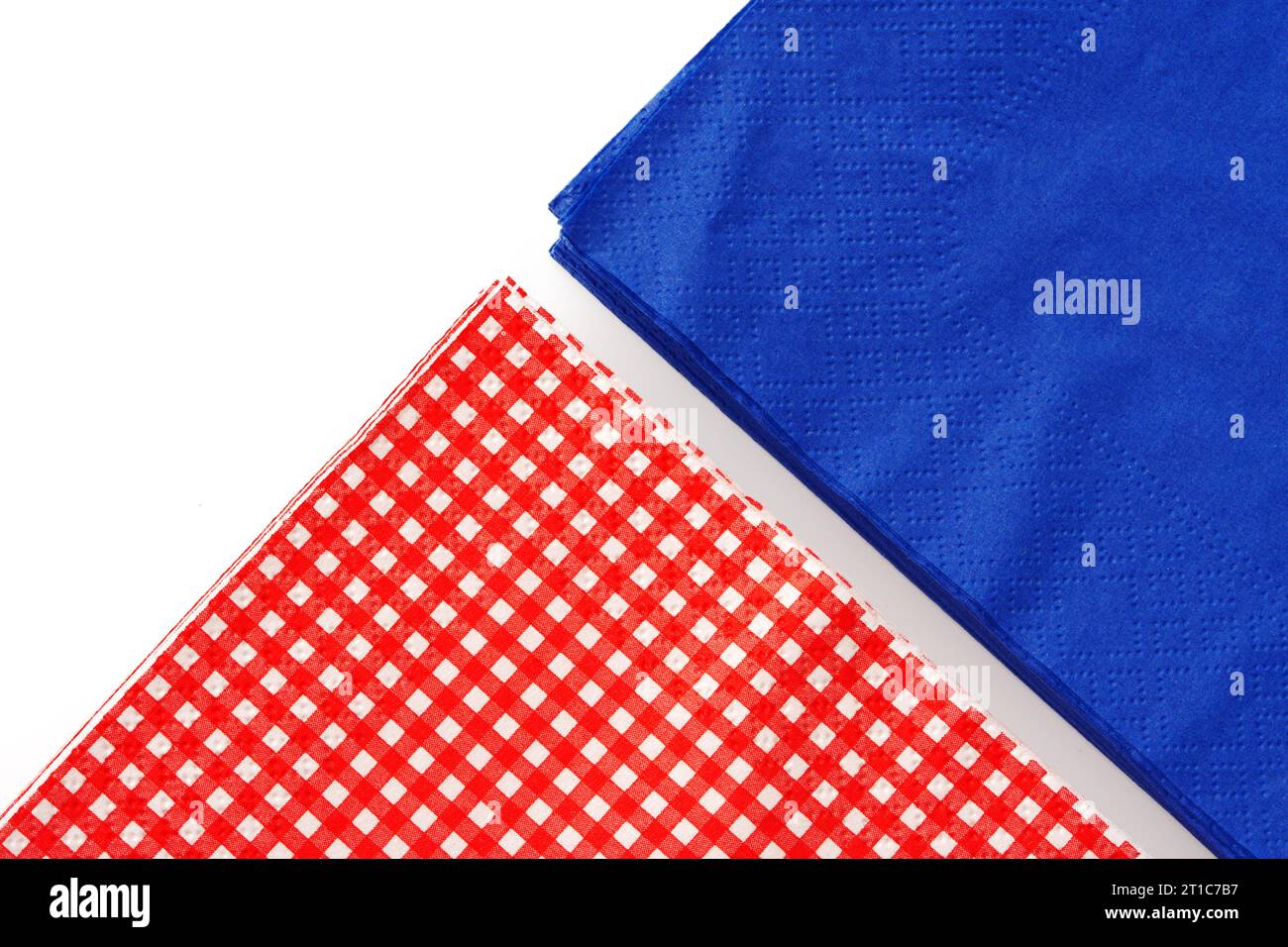 Two stacks of colorful paper napkins on white background Stock Photo ...