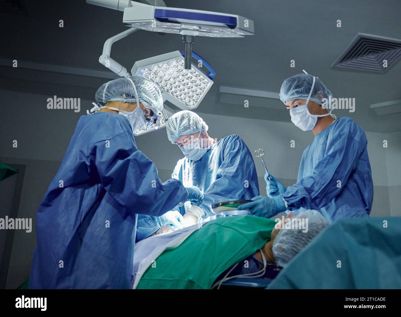 Surgical team doing operation patient hi-res stock photography and ...