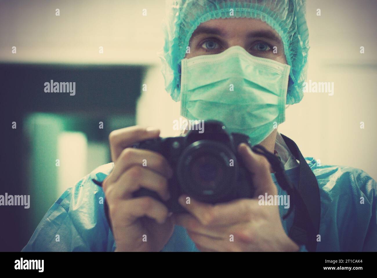 Young doctor photographing the medical procedures during surgery Stock ...