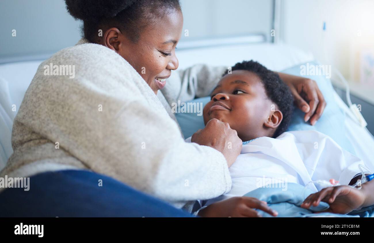 Hospital, bed and black woman with care for child, wellness and hug ...