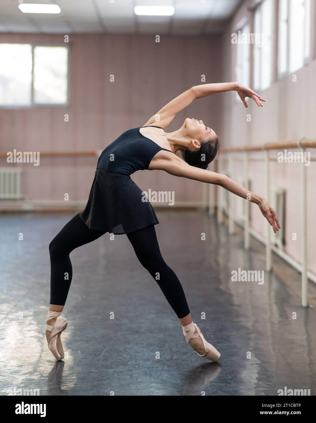 Asian woman dancing in ballet class. Bending in the back Stock Photo ...