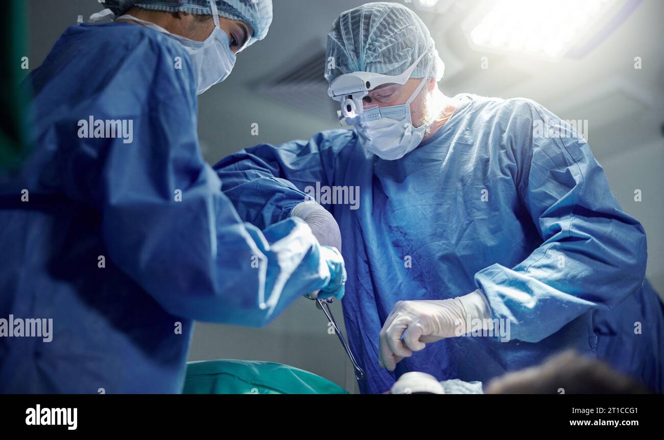 Healthcare, teamwork and doctors in a hospital for surgery together ...