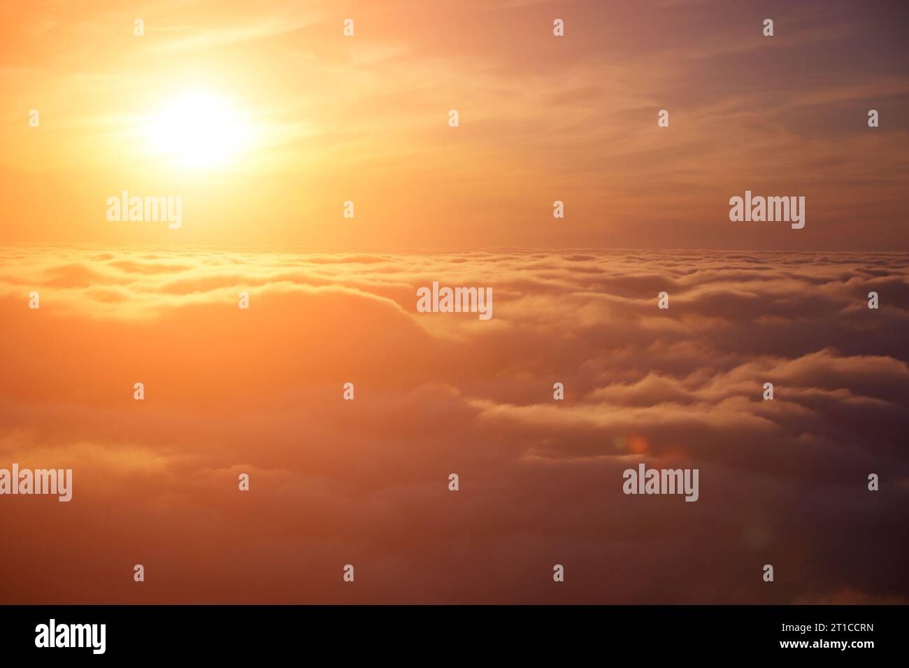 Beautiful sunset on the hill above clouds Stock Photo - Alamy