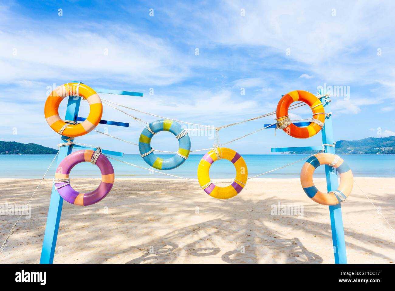 Artificial swim ring rubber on the beach with blue sky in summer Stock ...