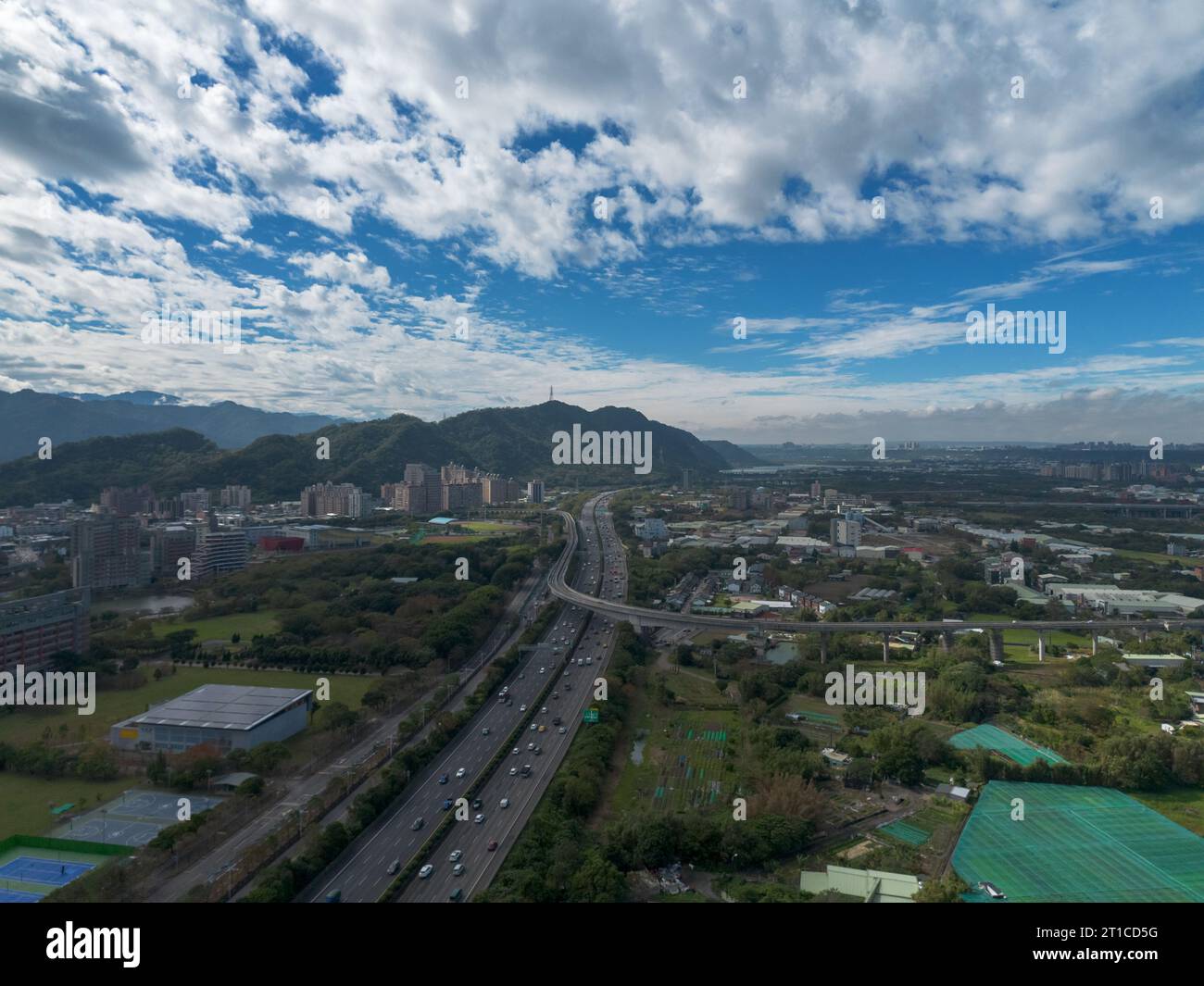 Aerial view of Sanxia District with cars on highway in New Taipei City, Taiwan. National Taipei ...