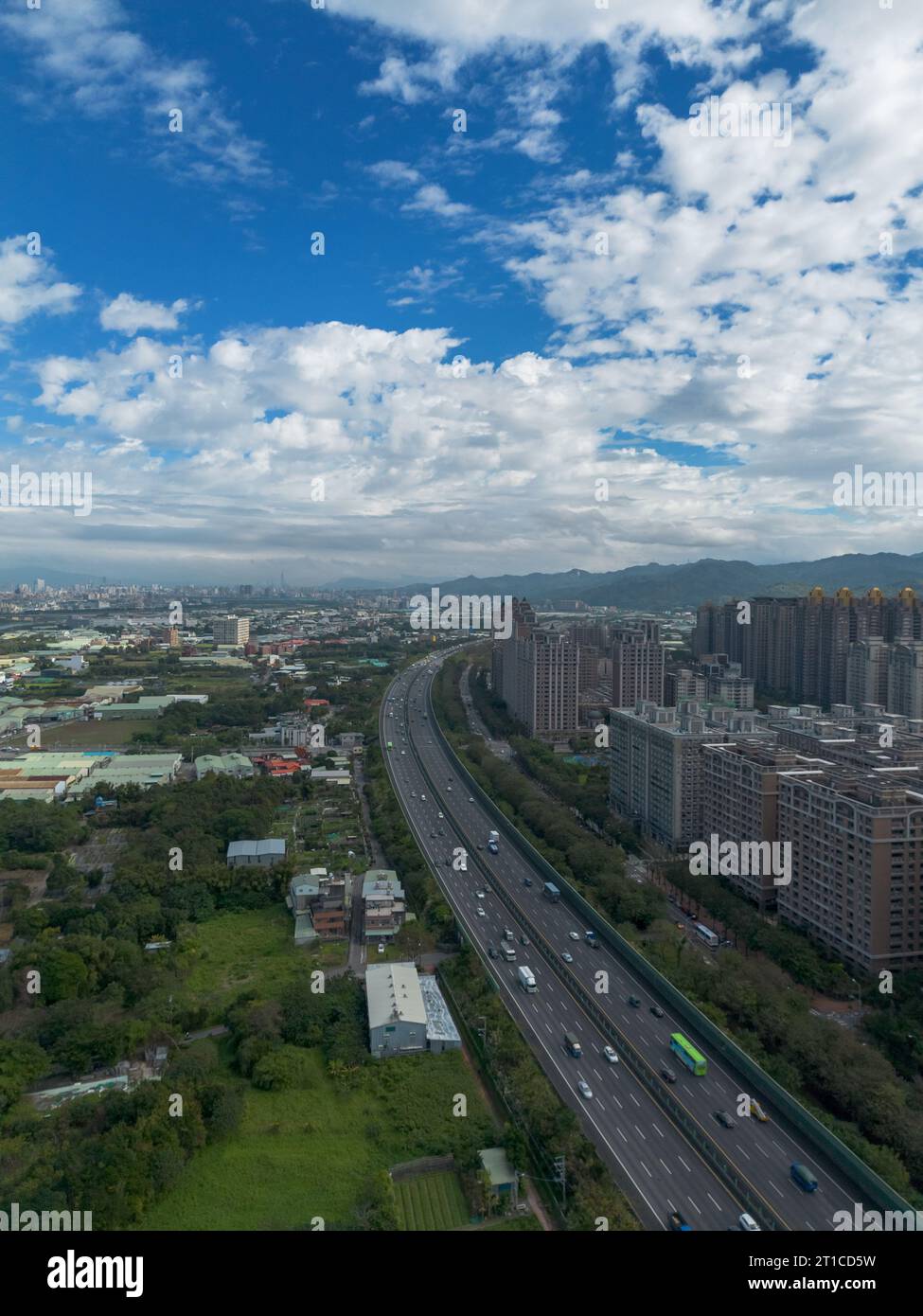 Aerial view of Sanxia District with cars on highway in New Taipei City, Taiwan. National Taipei ...