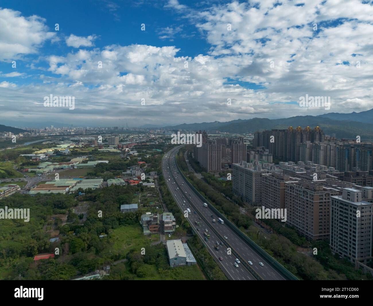 Aerial view of Sanxia District with cars on highway in New Taipei City, Taiwan. National Taipei ...