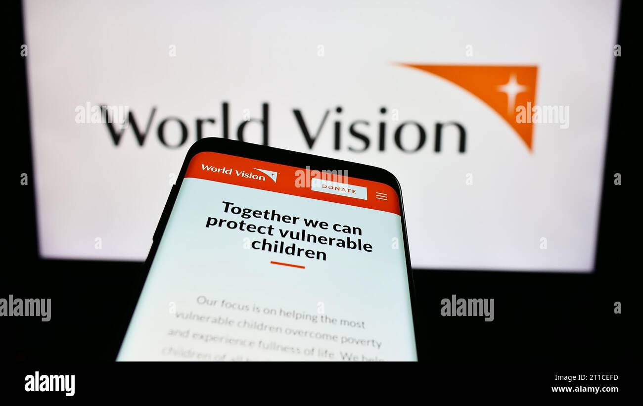 Mobile phone with website of charity organization World Vision ...