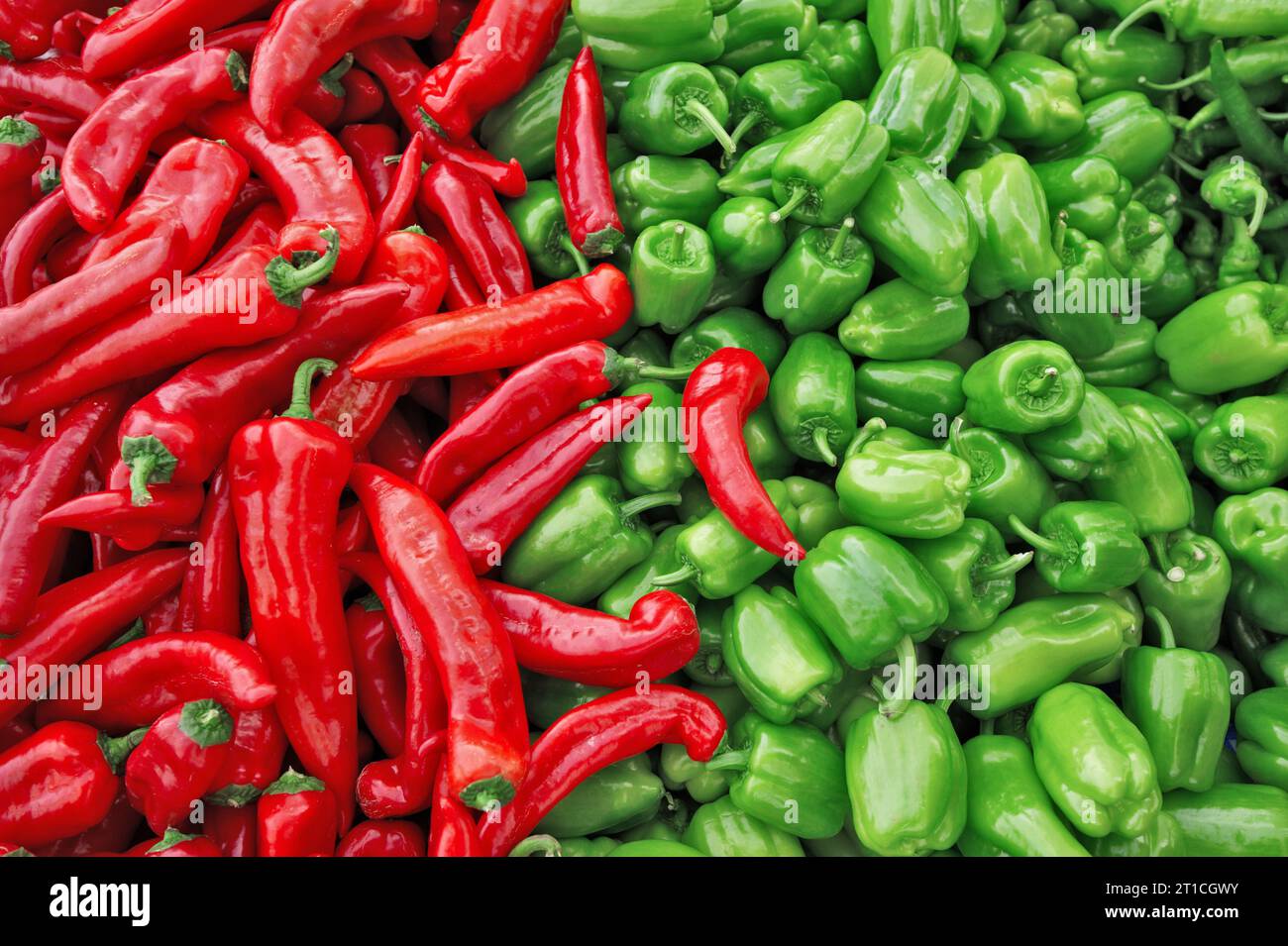 Fresh green and red organic bell peppers capsicum on display for sale ...