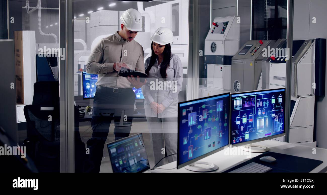 Factory Engineers In Helmets. Checking Industrial Facility Stock Photo ...