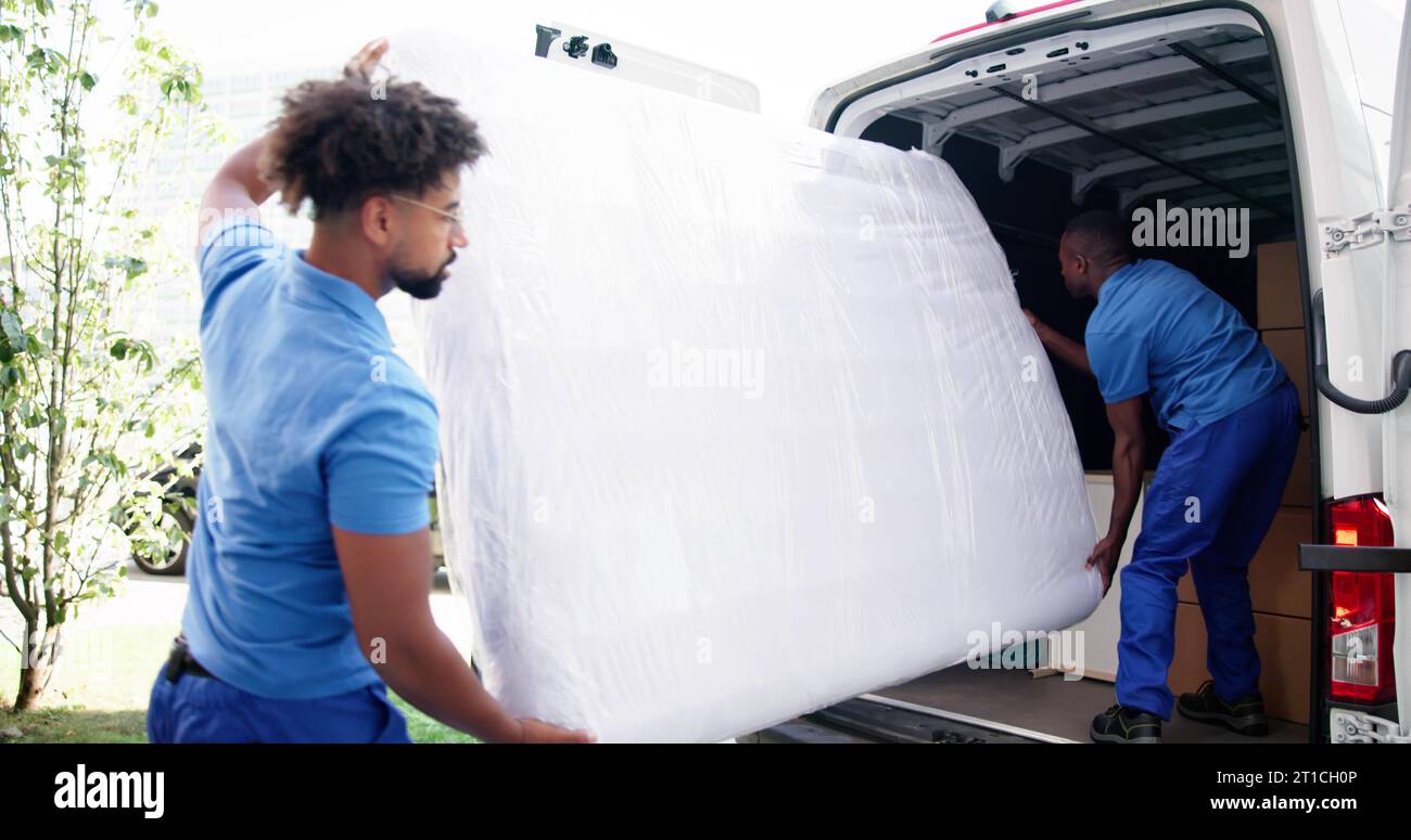 Mattress Move And Delivery Using Mover Truck Furniture Transport Stock