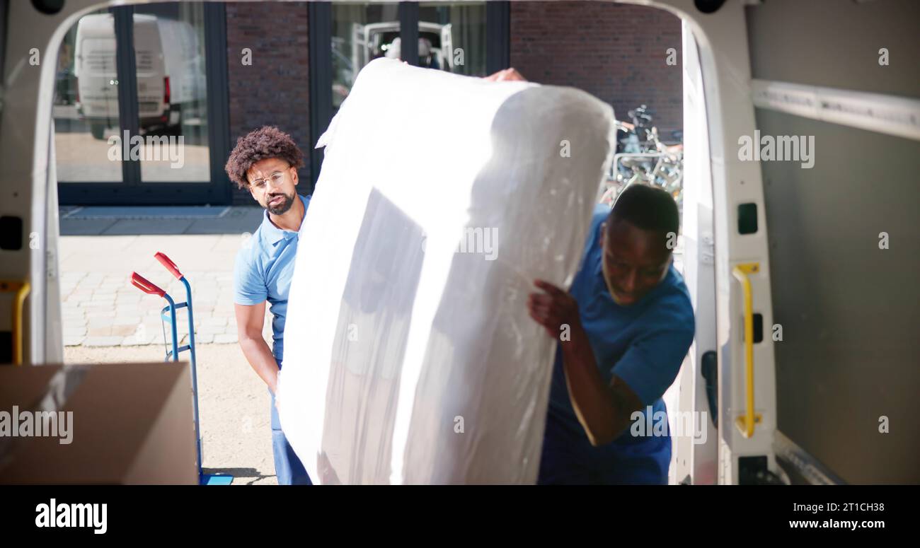 Mattress Move And Delivery Using Mover Truck Furniture Transport Stock