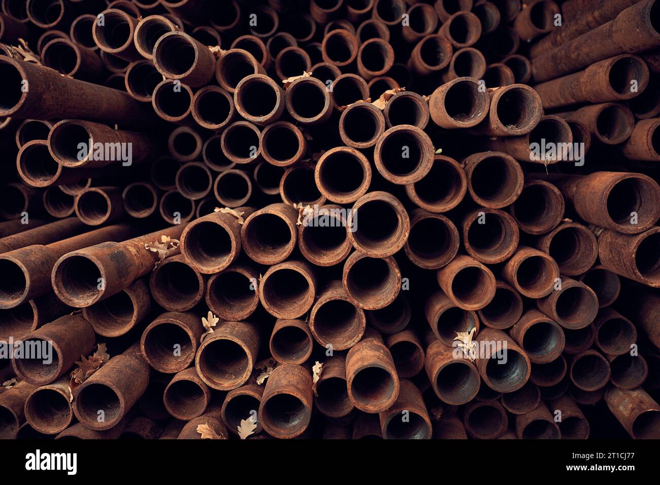 Rusty pipes background. End perspective view Stock Photo - Alamy