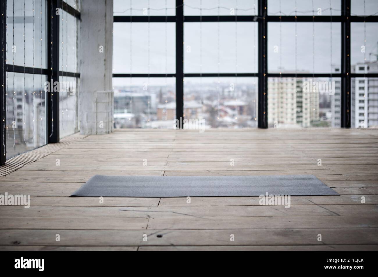 Empty space in fitness center, big windows, natural wooden floor ...