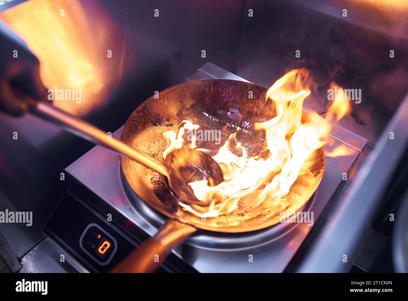Cooking with a wok and open fire hi-res stock photography and images ...