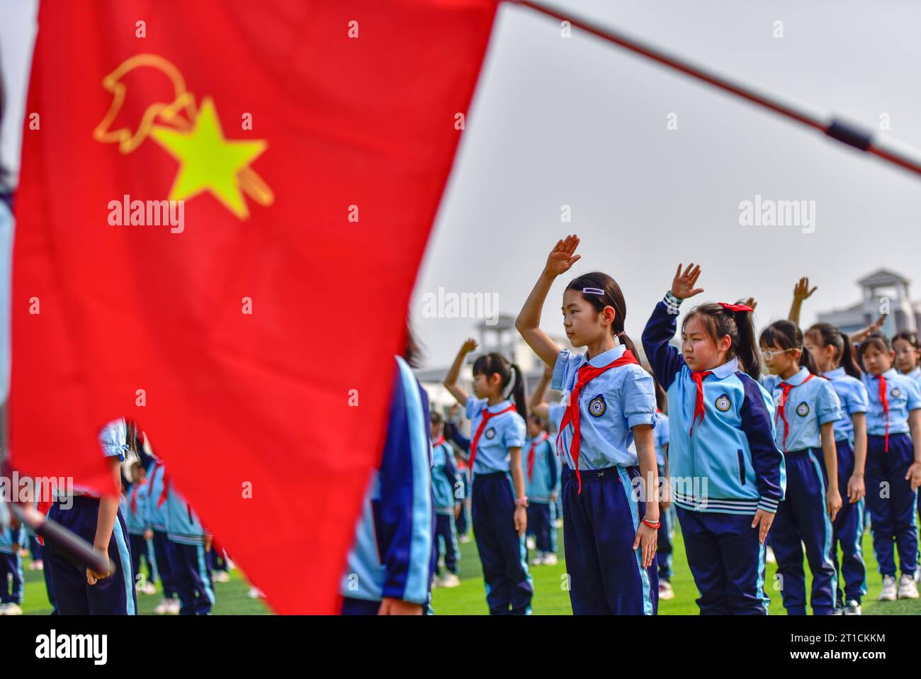 QINGZHOU, CHINA - OCTOBER 13, 2023 - Primary school students salute at ...