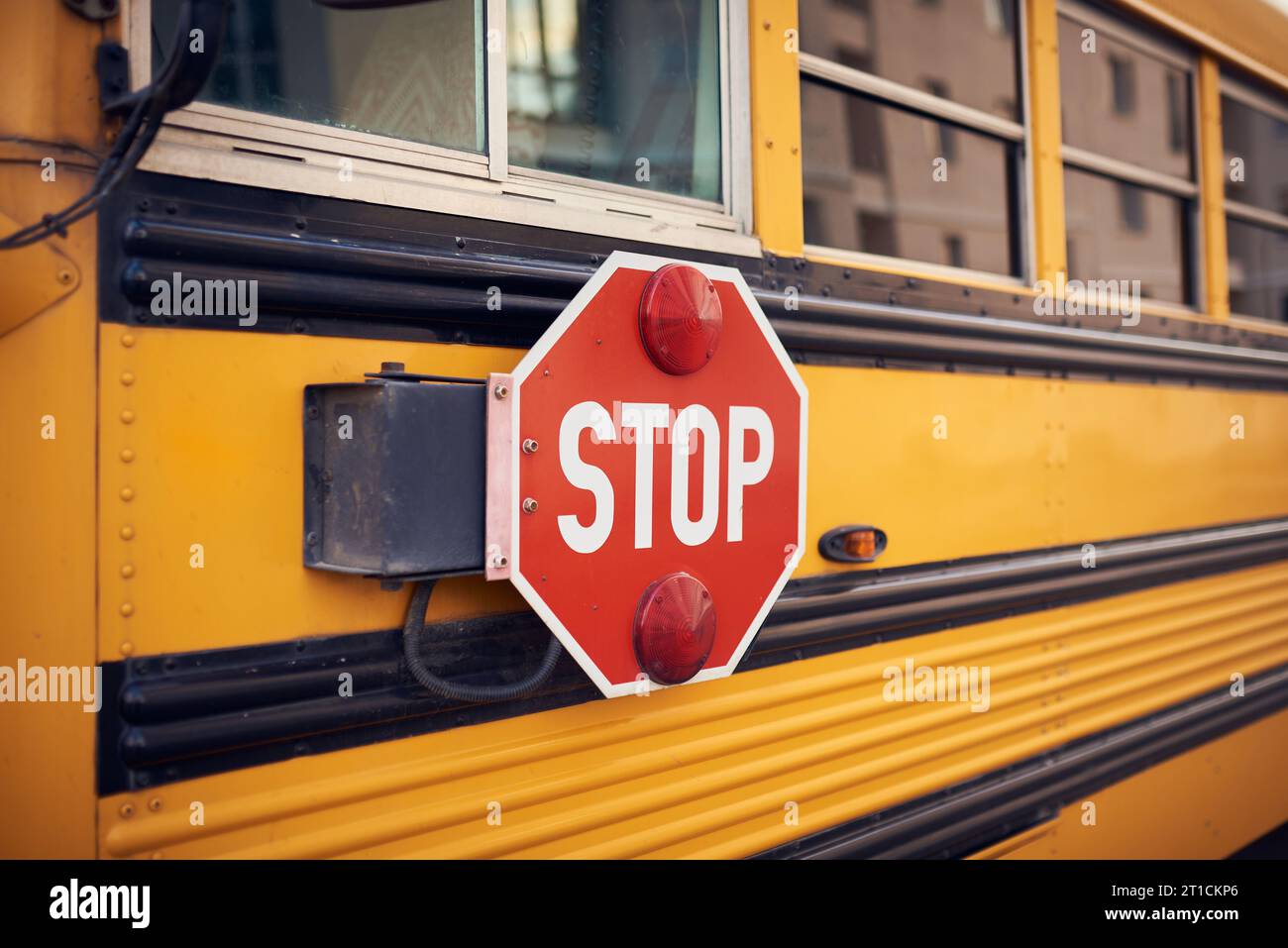 Side view of a school bus and its stop signal Stock Photo - Alamy