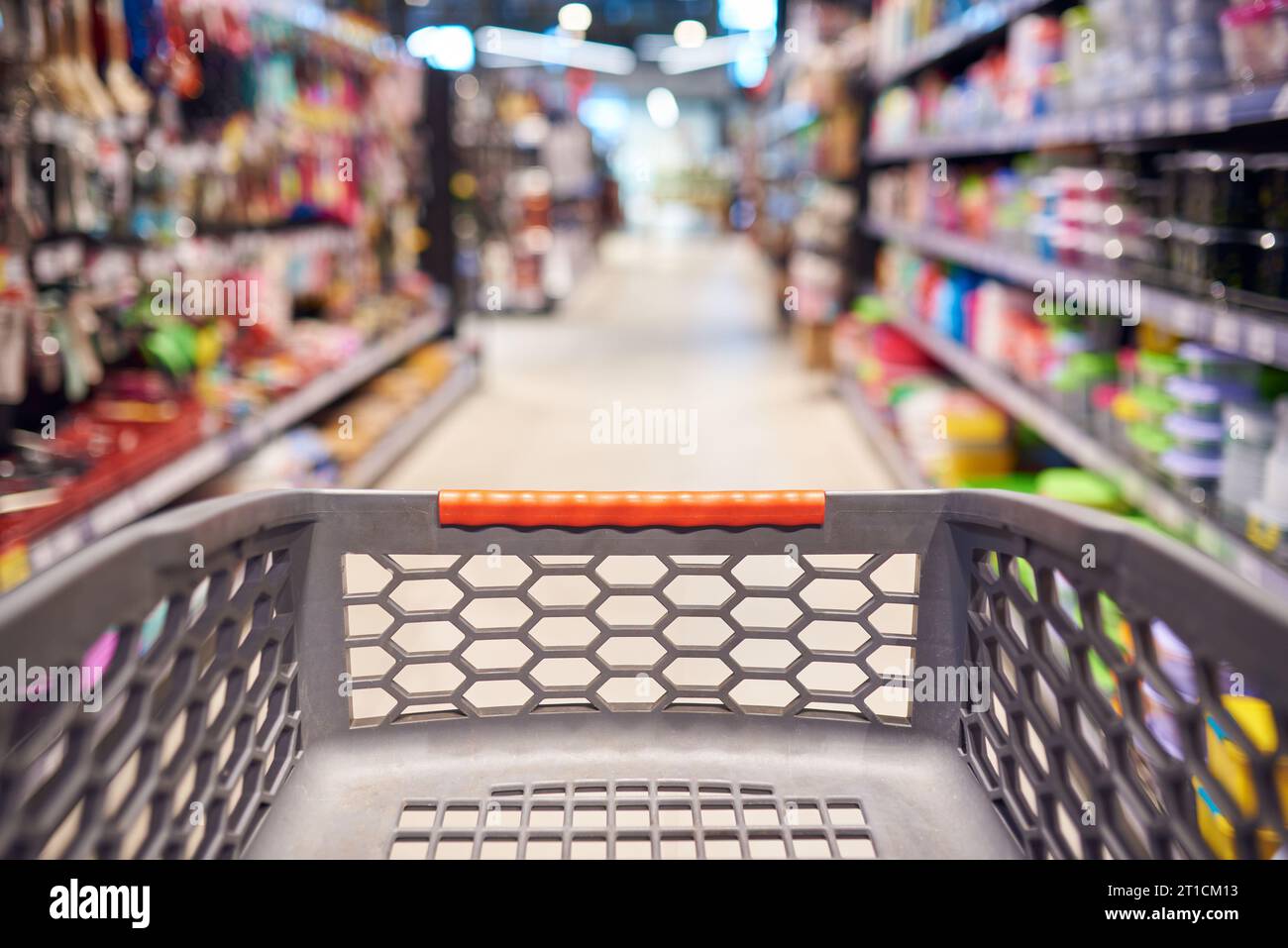 Abstract blurred photo of empty trolley in supermarket bokeh background ...