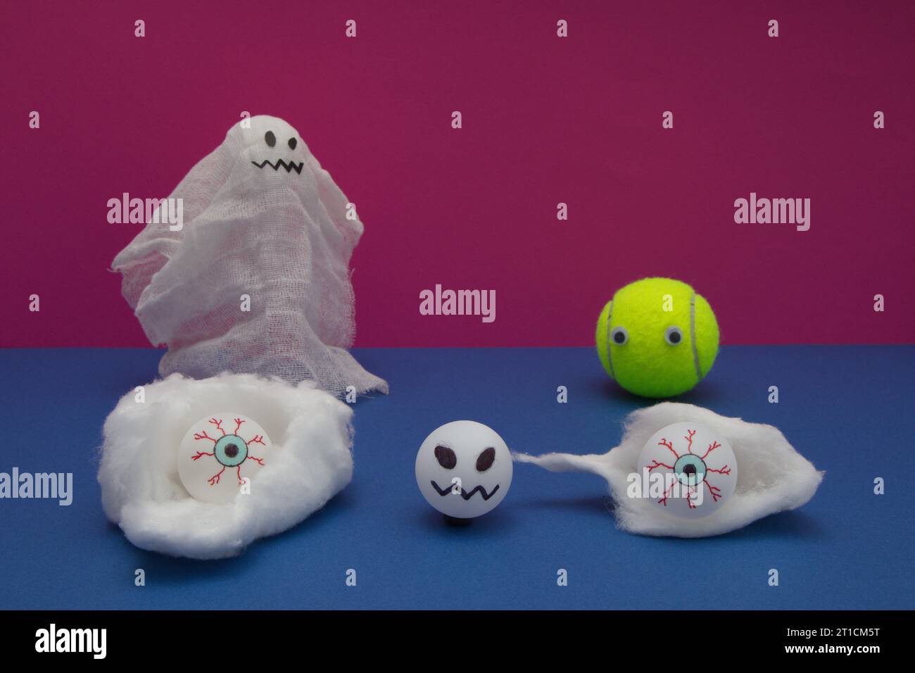 Creepy spirit, a tennis ball with eyes and in front of them dominant ...