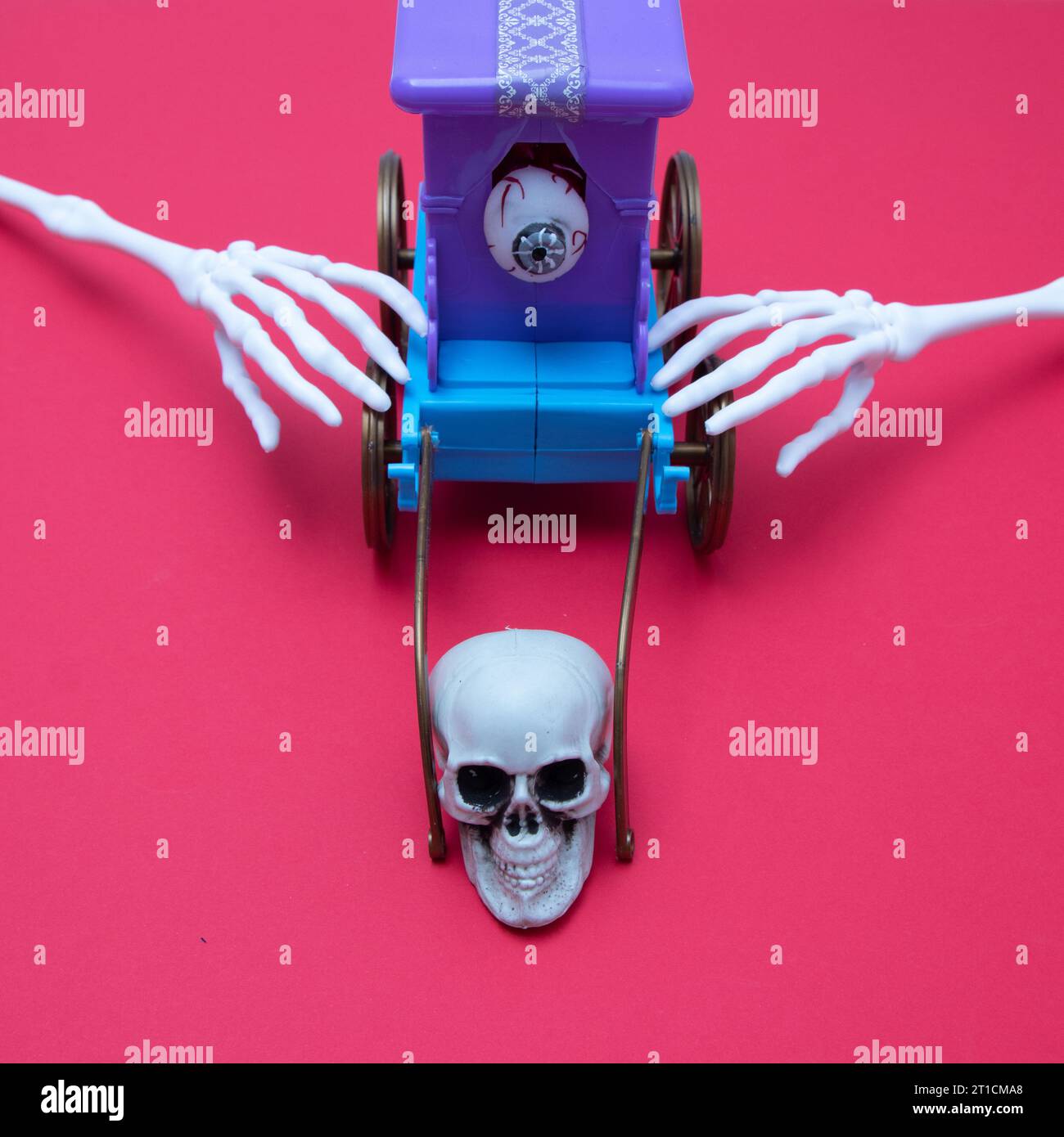 A chariot driven by a skull and grasped by skeleton hands on a red ...