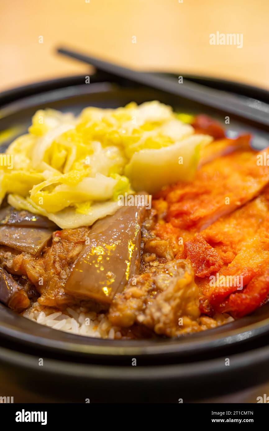 clay pot rice with Orlean baked chicken and eggplant and vegetable at ...