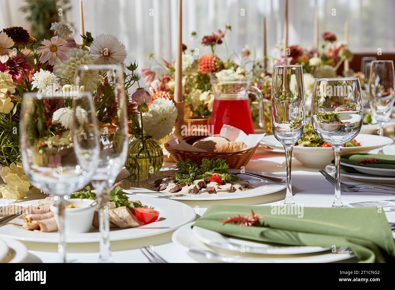 Graceful table setting in the elegant chamber features candles and ...