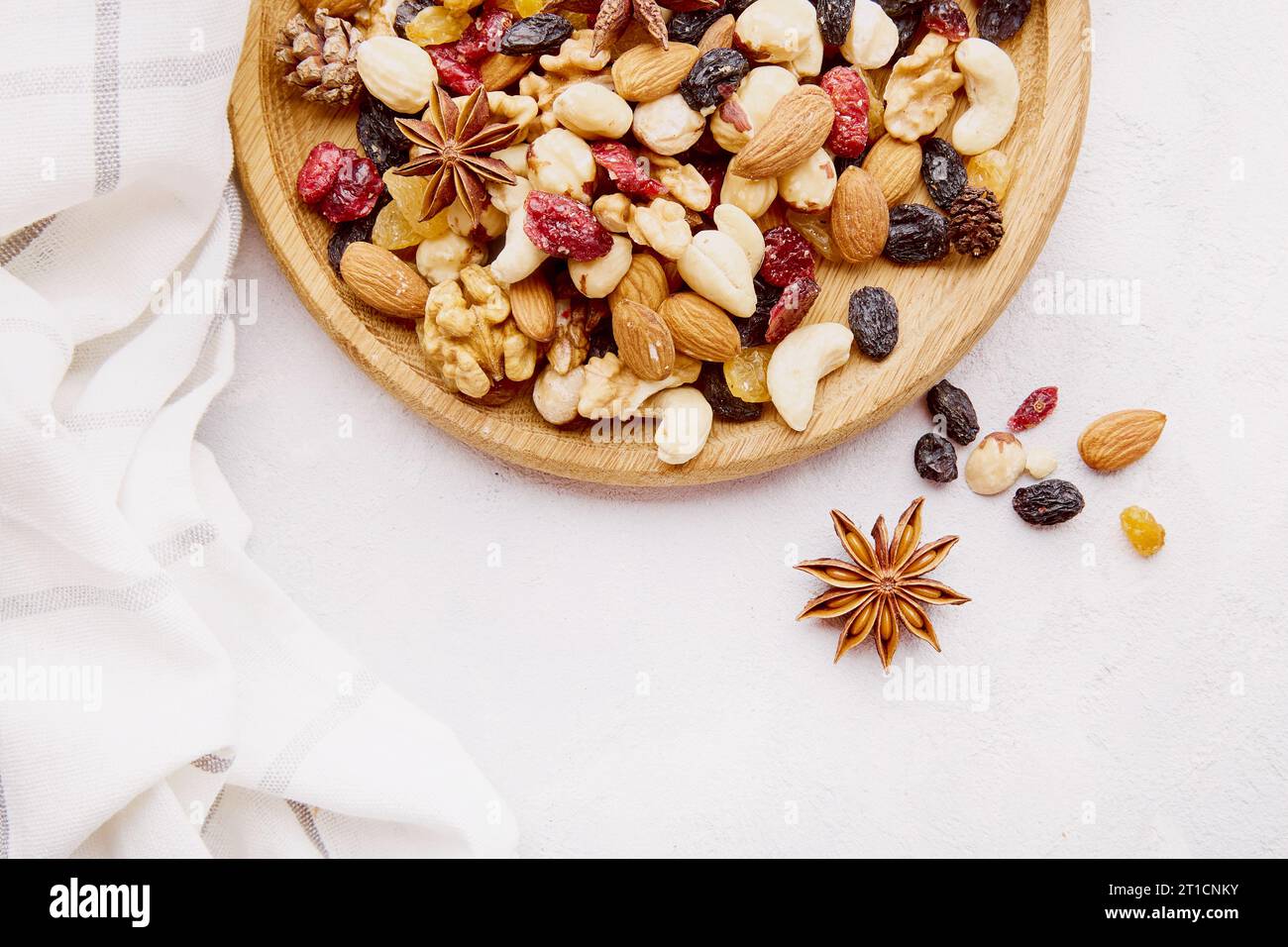 Aesthetic wooden bowl with assorted nuts, raisins and cranberries from ...