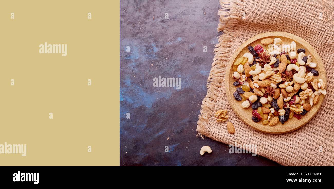 Aesthetic wooden bowl with assorted nuts, raisins and cranberries from ...