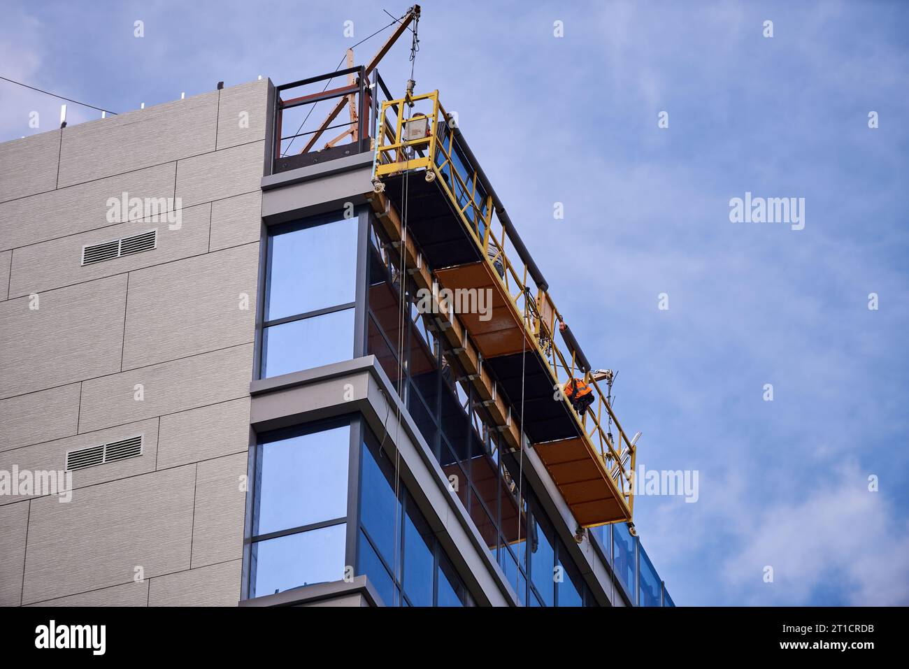 office building under construction. Facing and insulation of walls ...