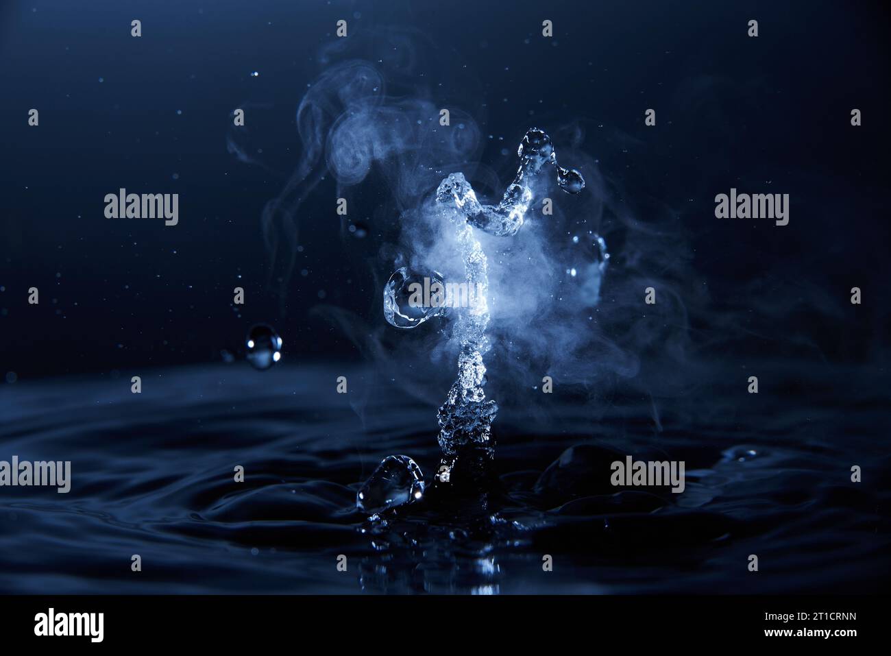 Boiling water splash with steam on dark blue background closeup Stock ...