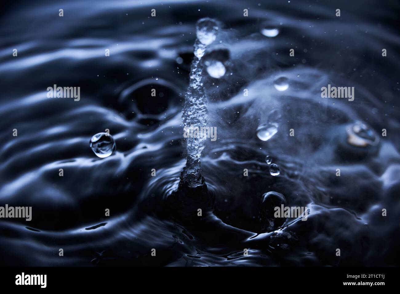 Boiling water splash with steam on dark blue background closeup Stock ...