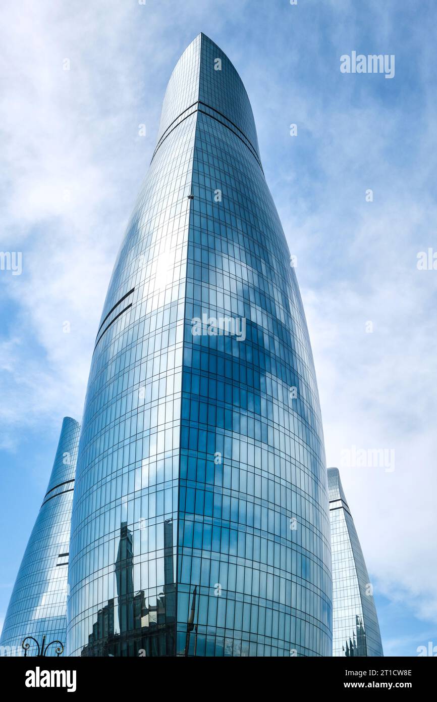 At the iconic, modern, blue glass Flame Towers, designed by HOK. In ...