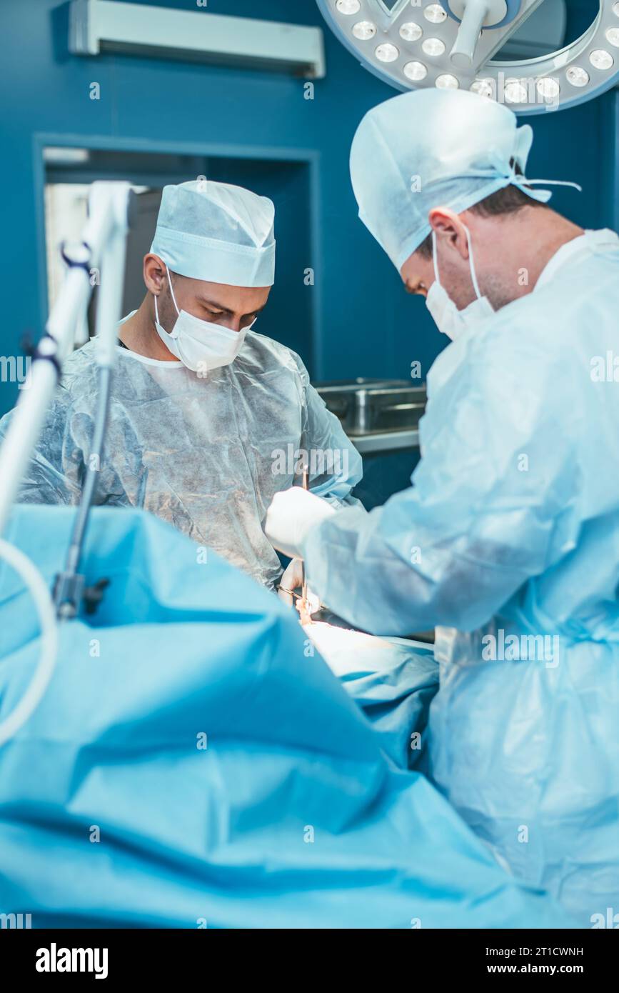 Male surgical team performs surgery hi-res stock photography and images ...