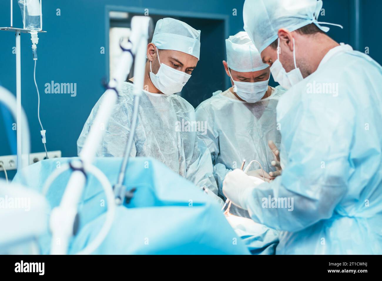 Doctor doing surgery in hi-res stock photography and images - Alamy
