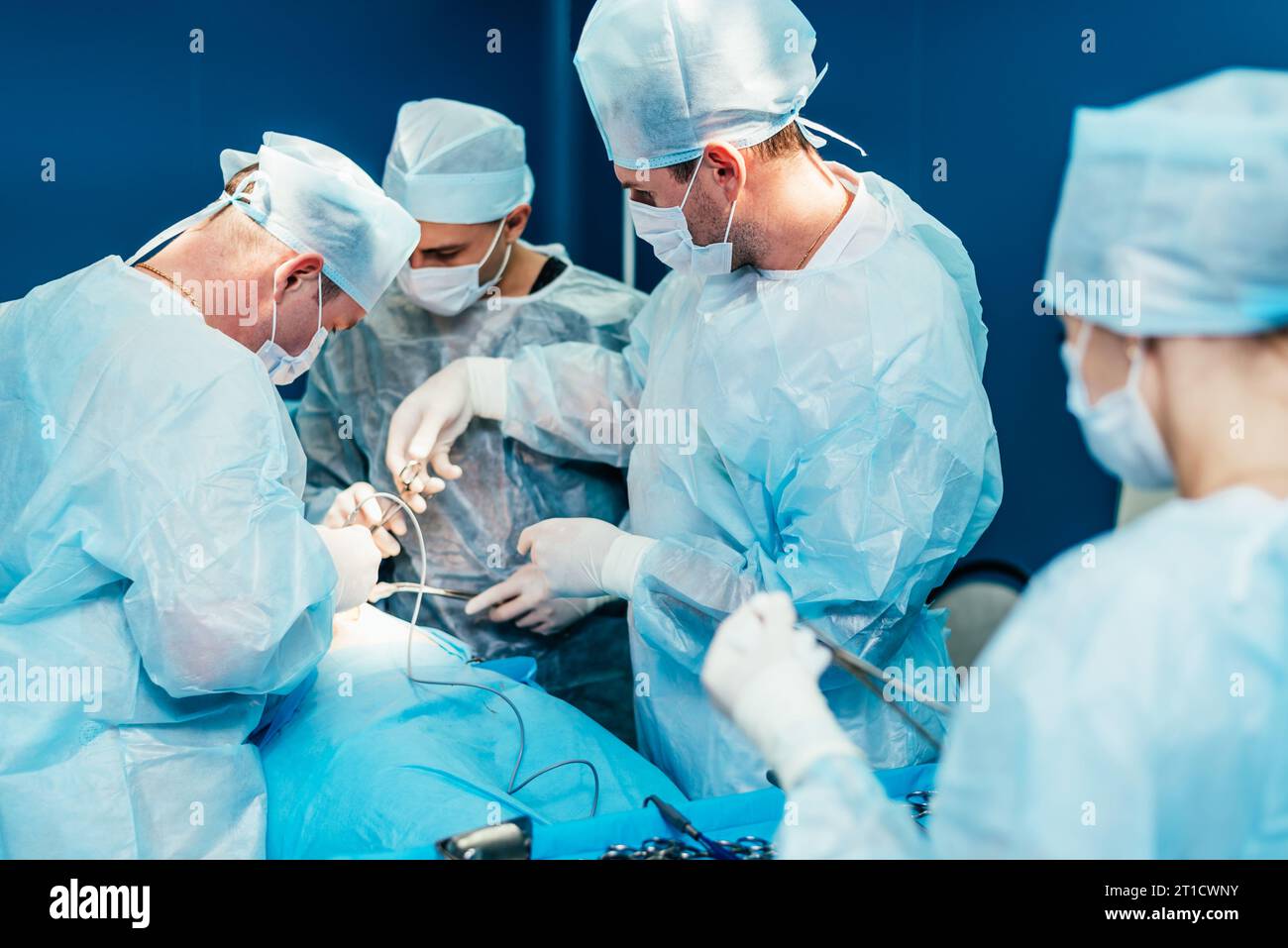 Male surgical team performs surgery hi-res stock photography and images ...
