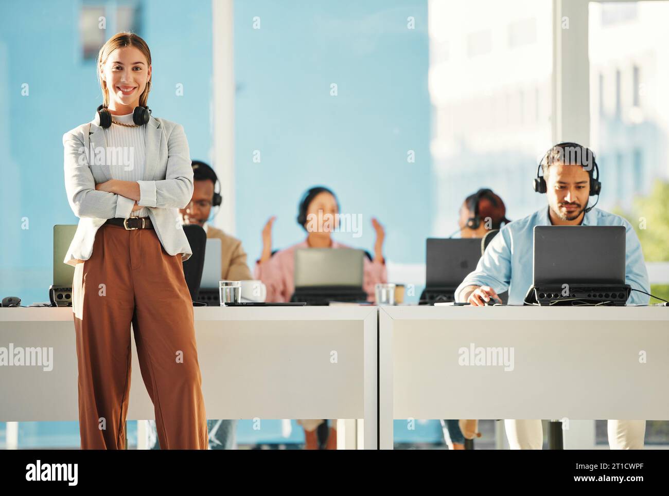 Call center manager, woman and arms crossed in portrait for leadership, telemarketing staff or ...