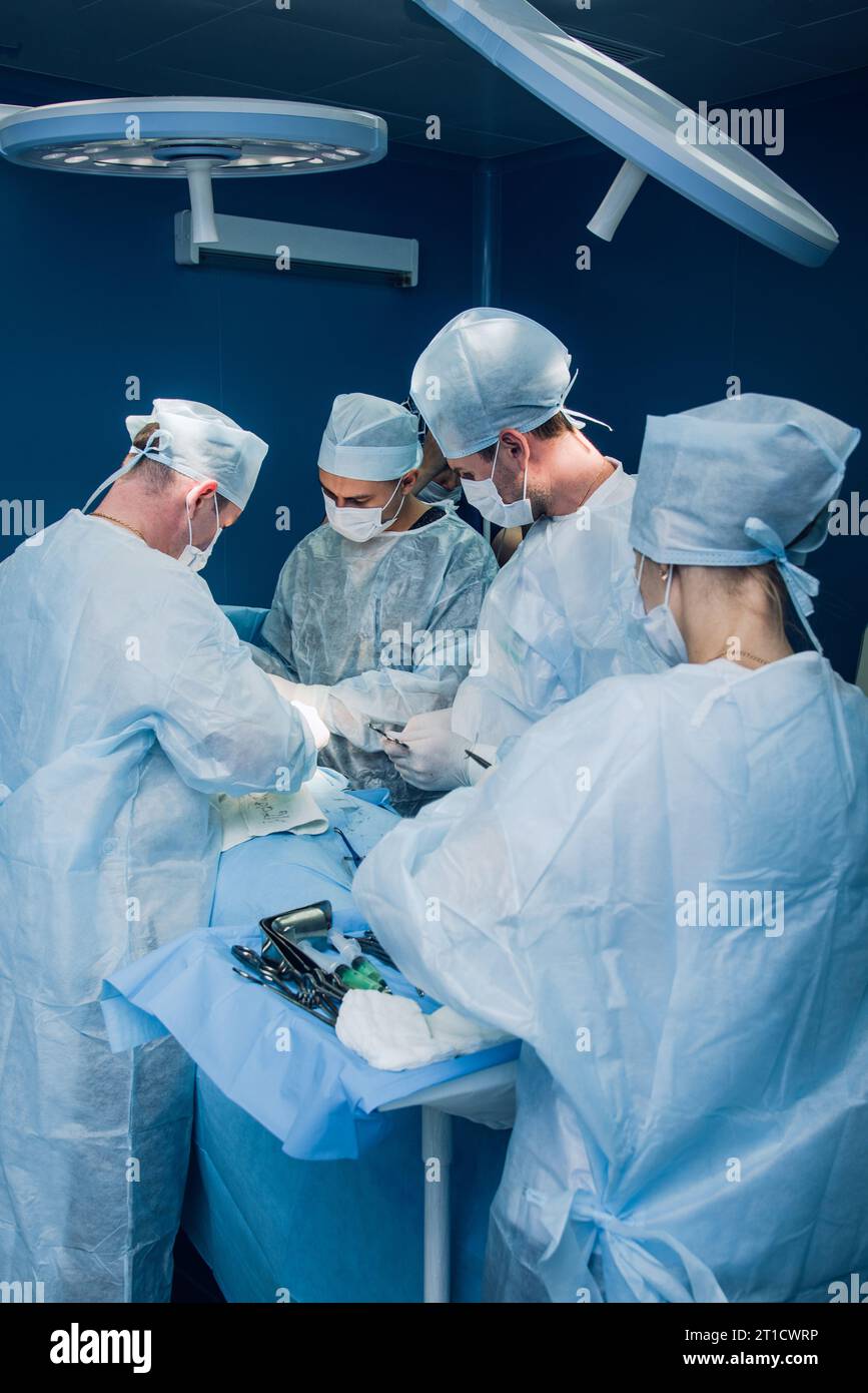Male surgical team performs surgery hi-res stock photography and images ...