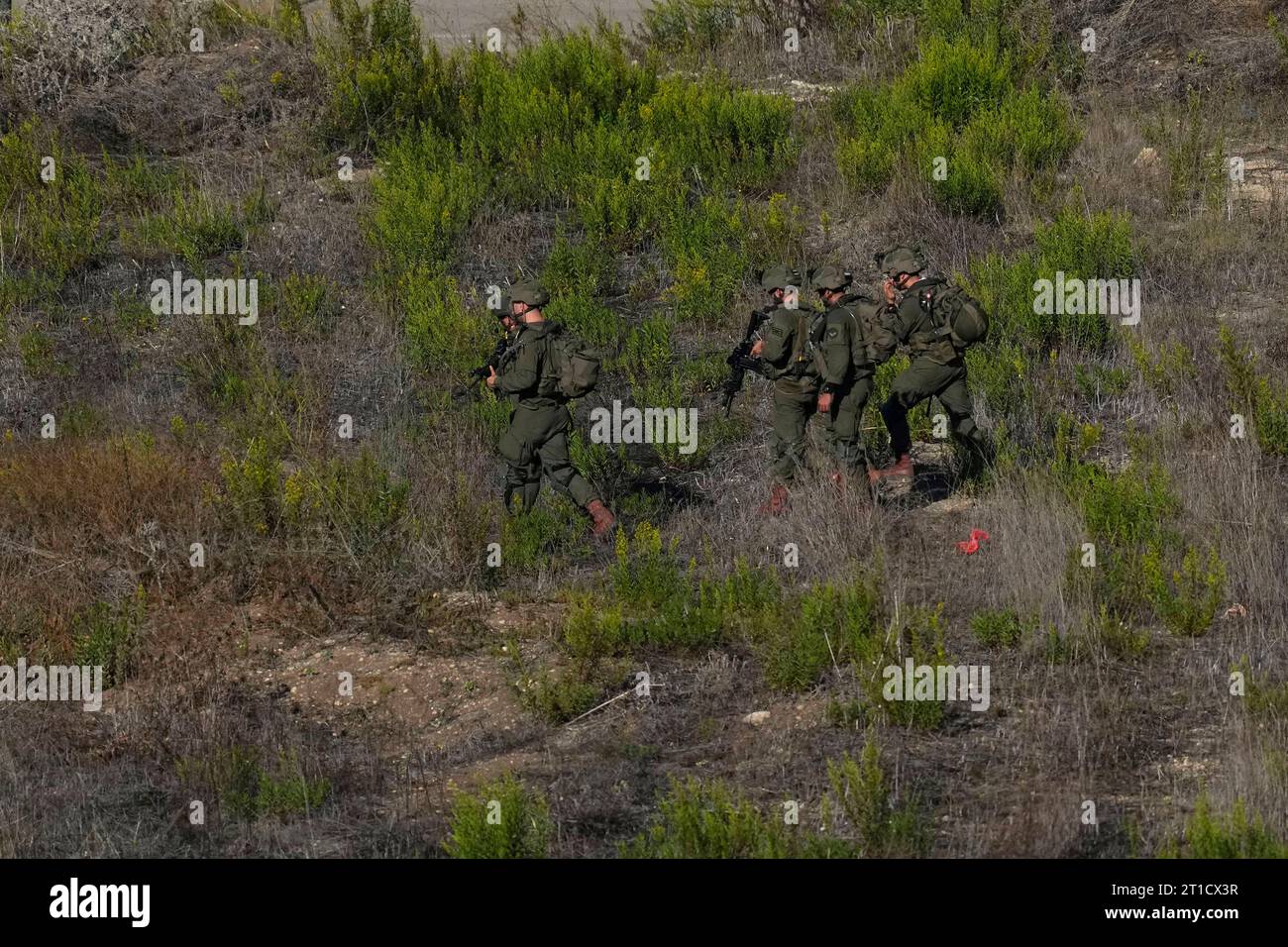 Israeli soldiers are deployed in the Israeli town of Metula, as seen ...