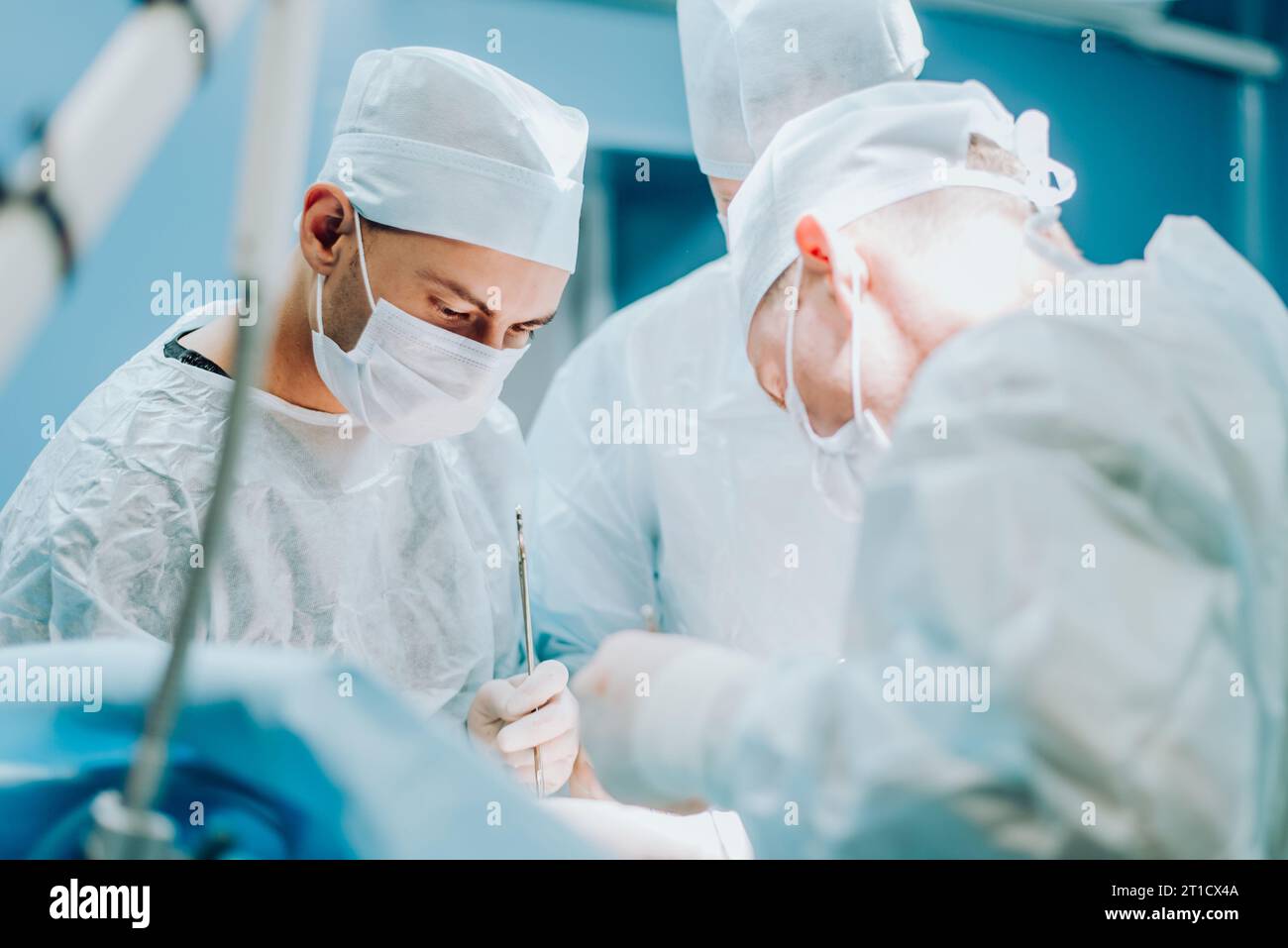 Male surgical team performs surgery hi-res stock photography and images ...