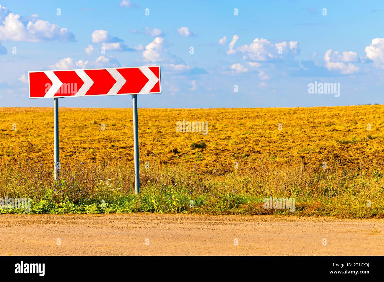 road sign indicating a sharp right turn. warning road sign on a country ...