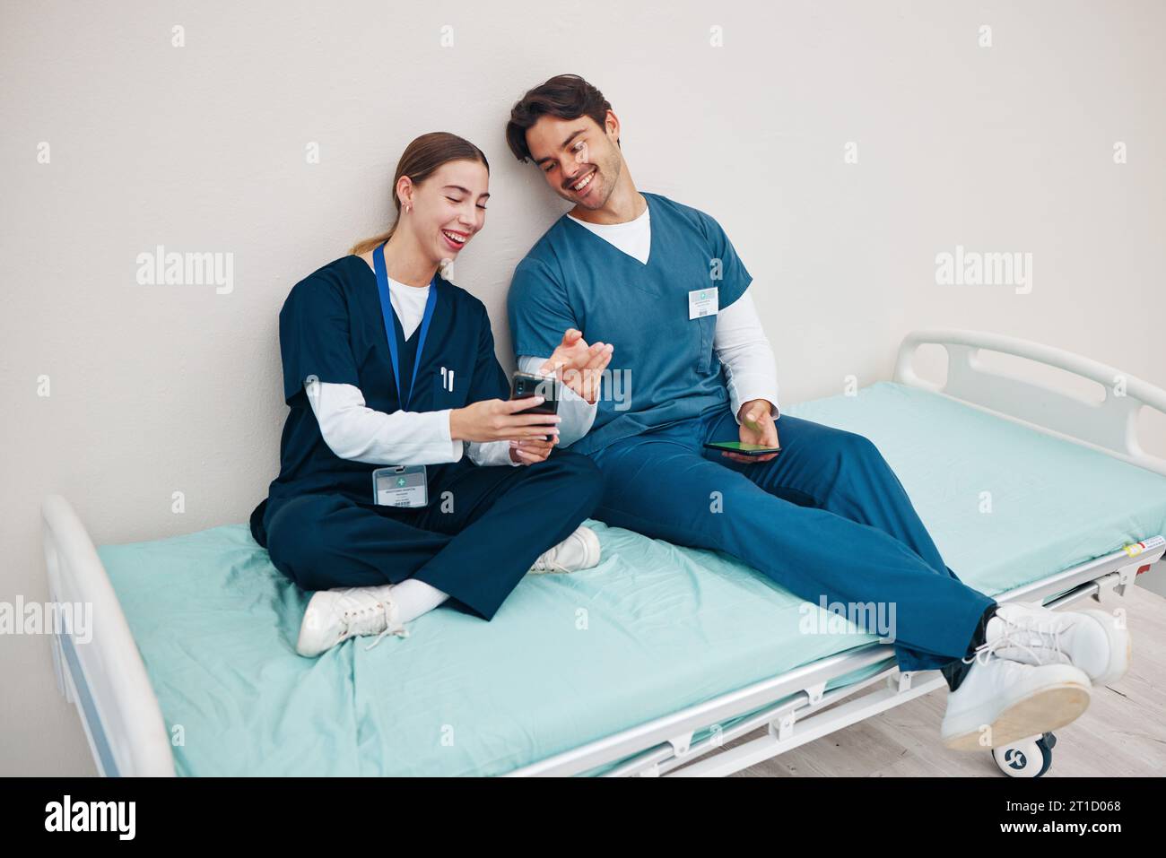 Doctors, smartphone and break on hospital bed, relax and happy from ...