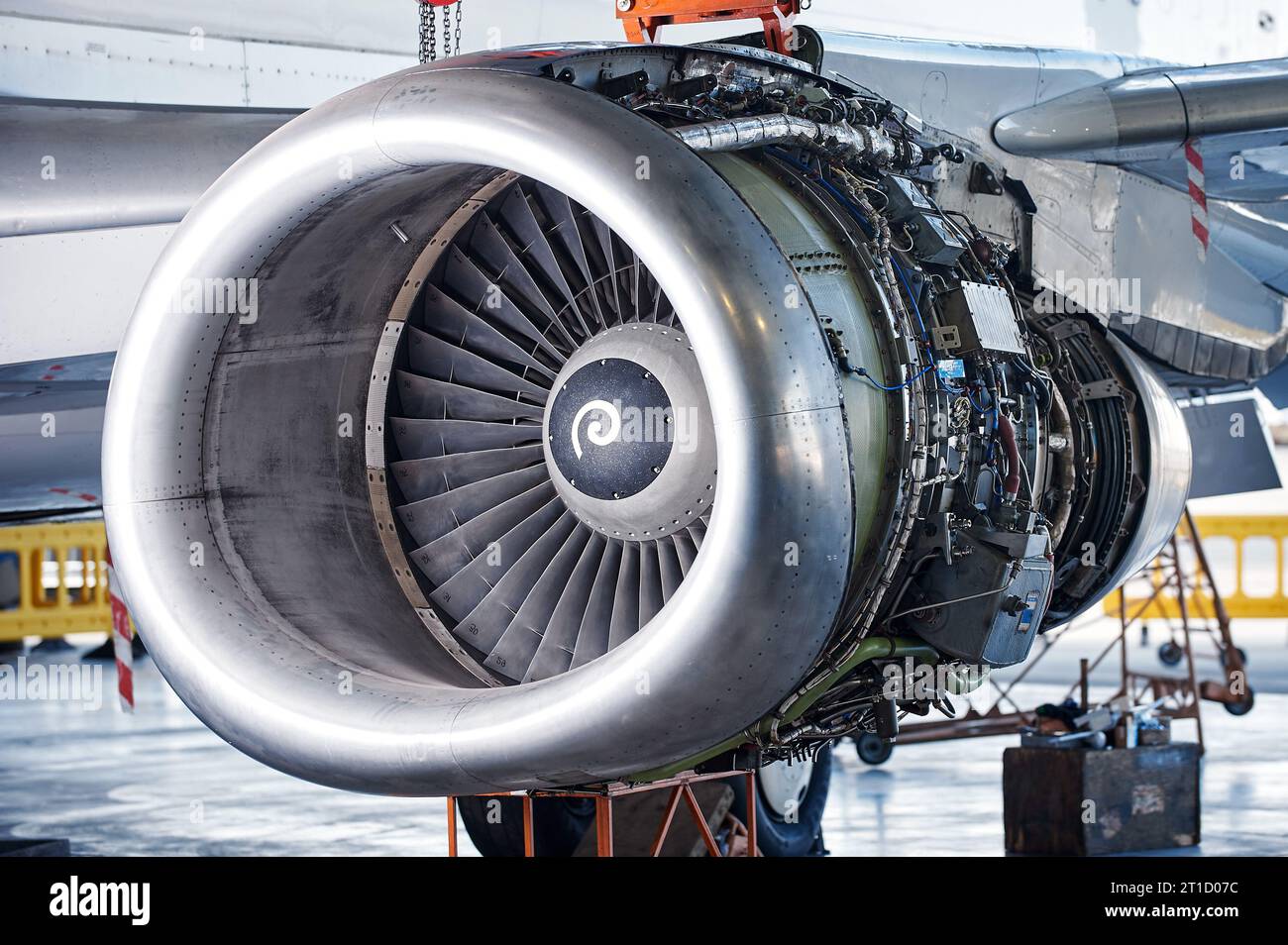 aircraft engine servicing - opened panels of a large engine of parked ...