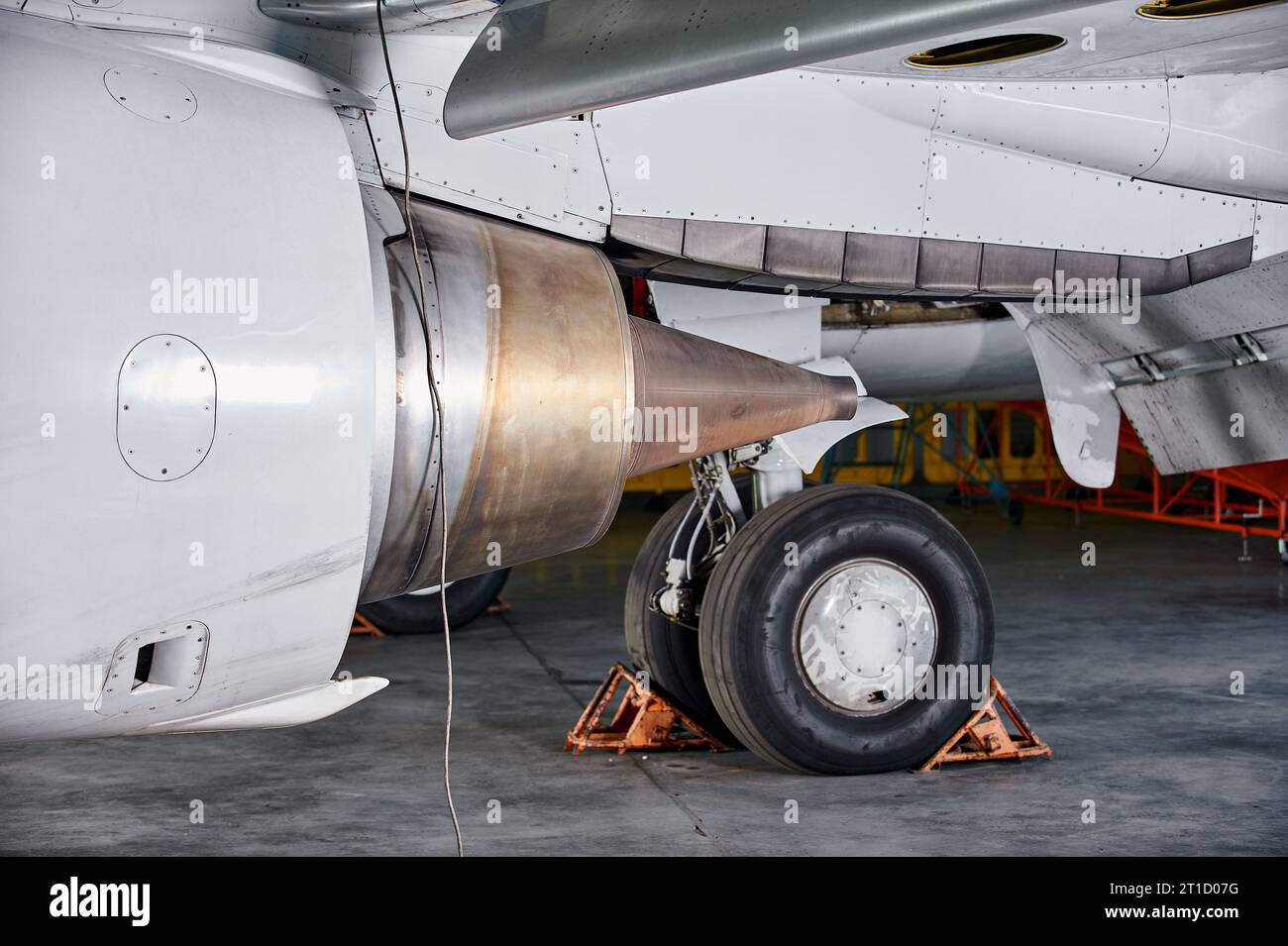 aircraft engine servicing - opened panels of a large engine of parked ...