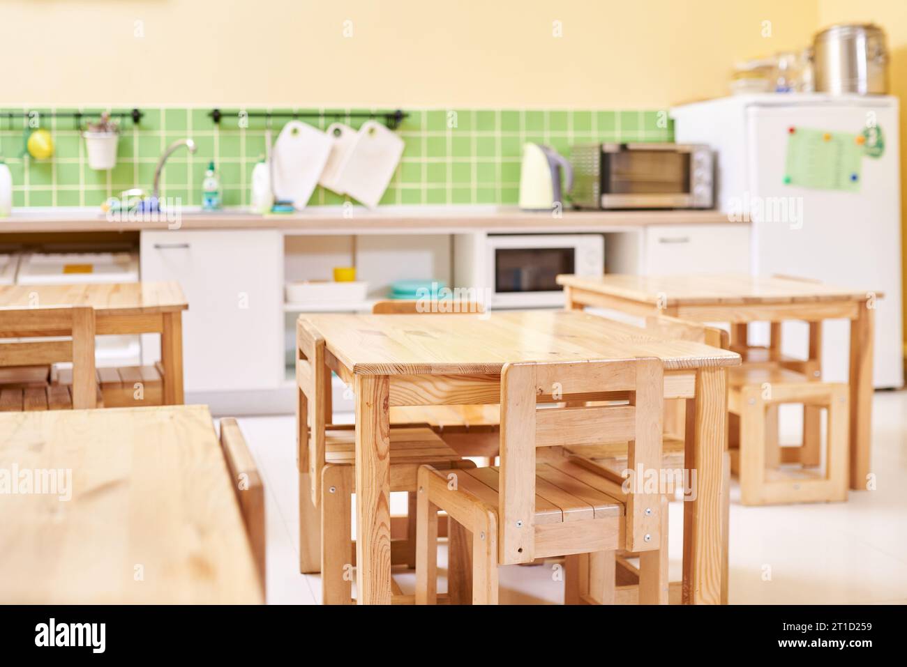 Light modern kitchen in Montessori kindergarten. wooden children's ...