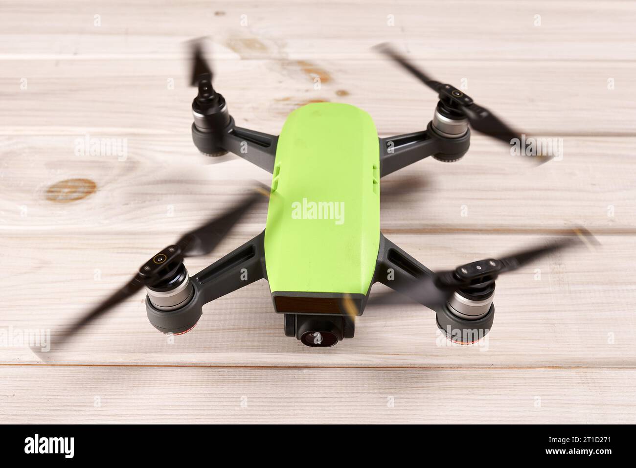 Drone with running engines and rotating propellers standing on the ...