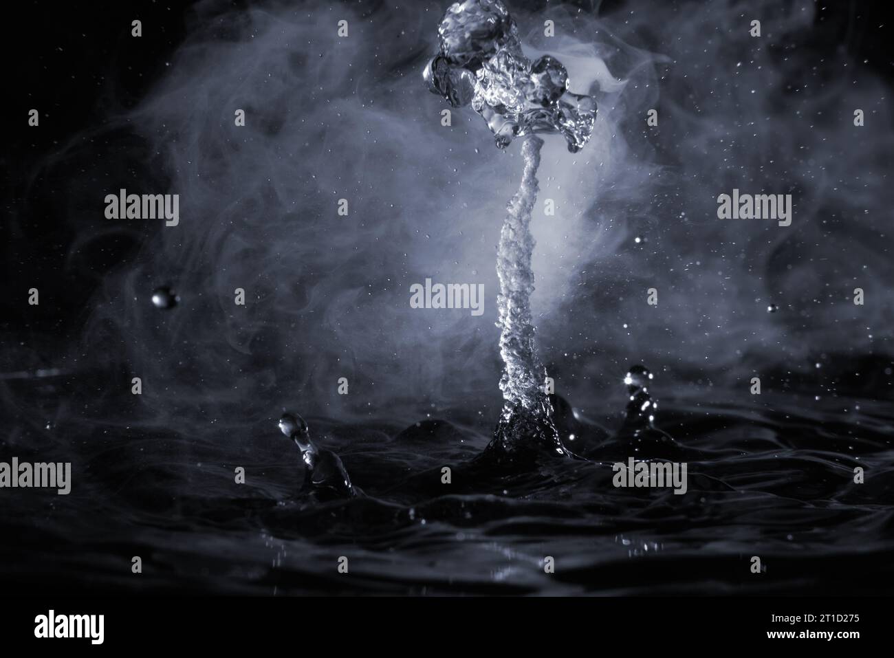 Boiling water splash with steam on black background closeup Stock Photo ...