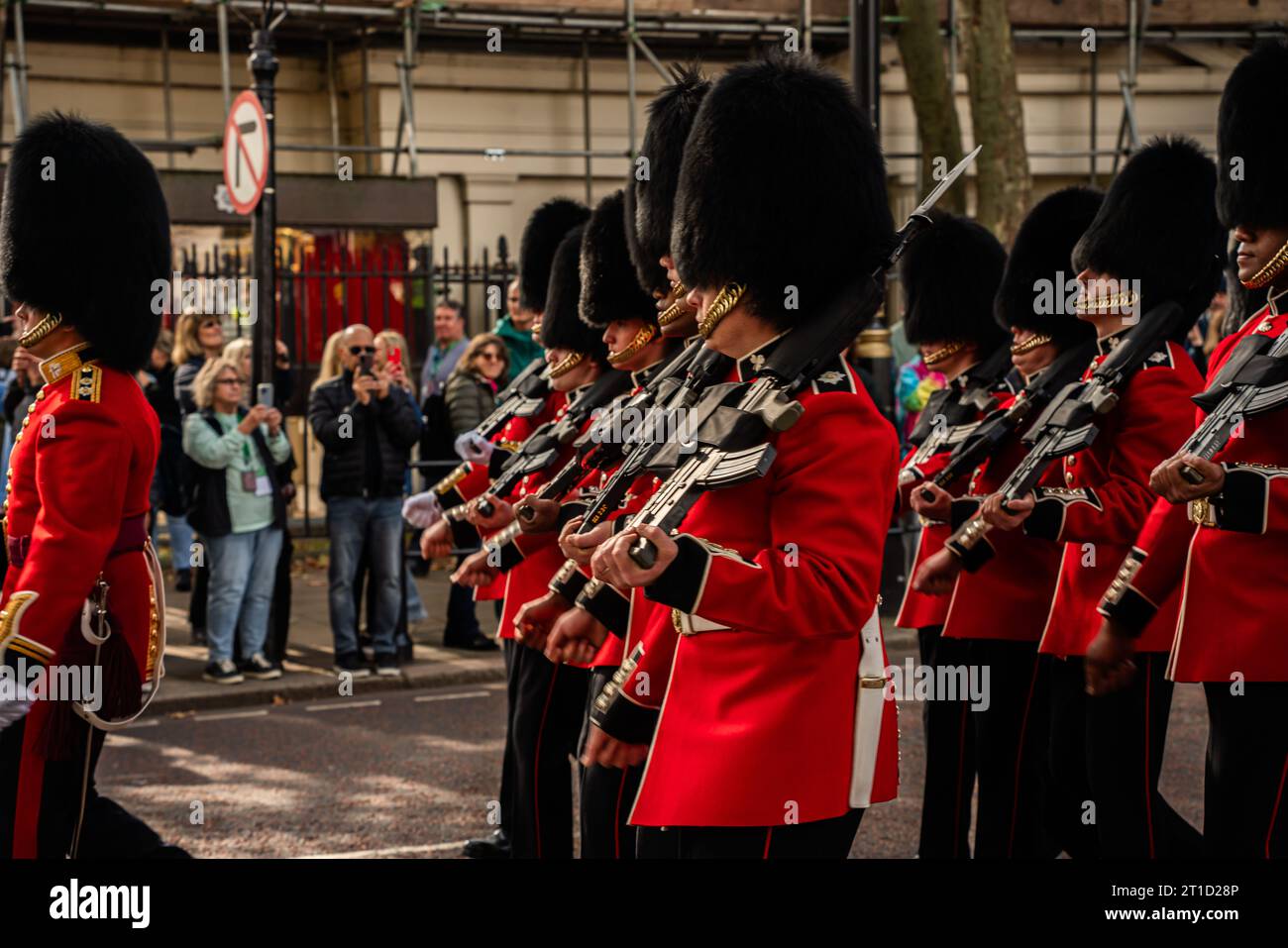Changing the Guards at Buckingham Palace takes place in front of ...