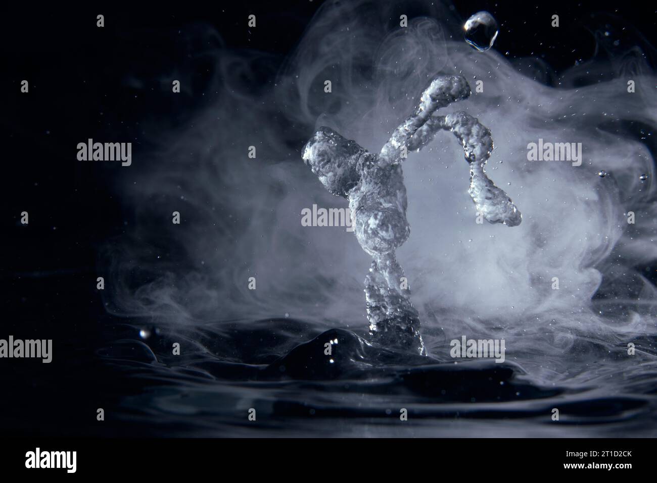 Boiling water splash with steam on black background closeup Stock Photo ...