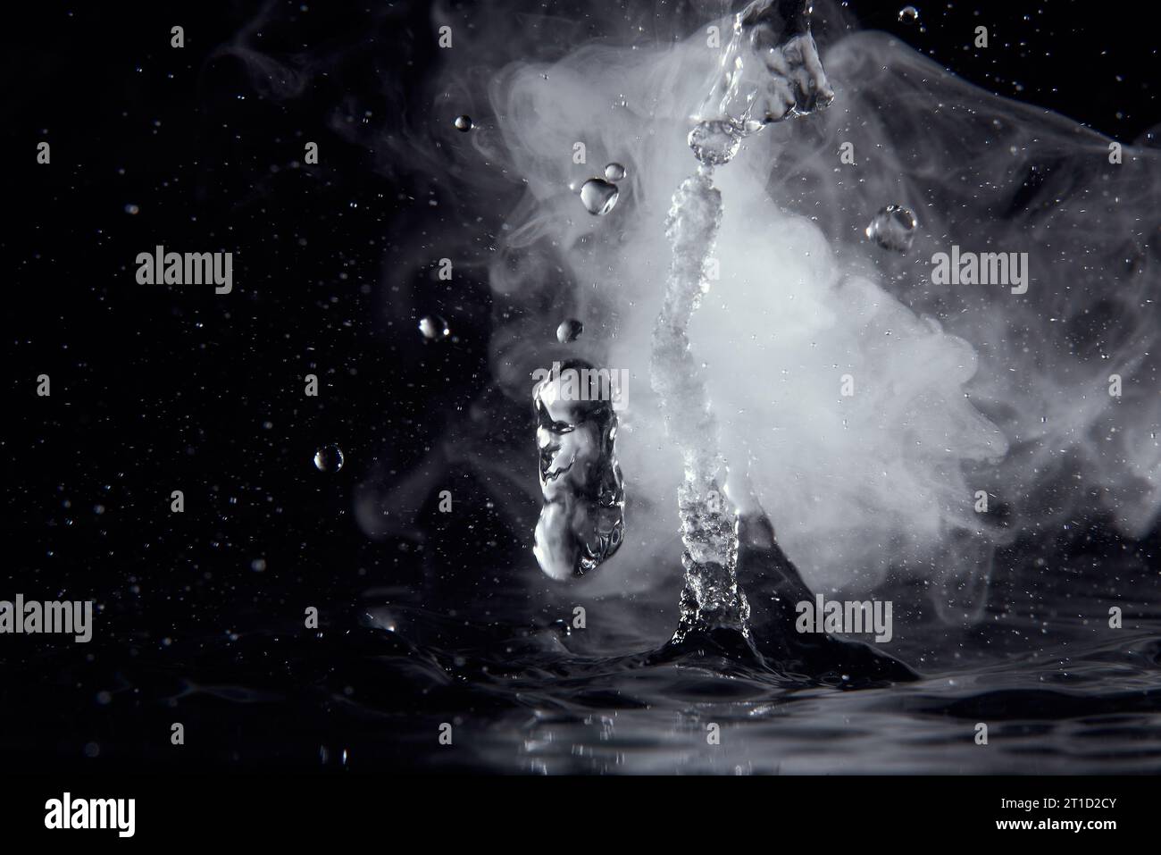 Boiling water splash with steam on black background closeup Stock Photo ...